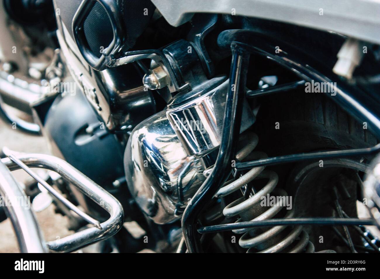Closeup of a motorcycle rolling in the streets of the city center of ...