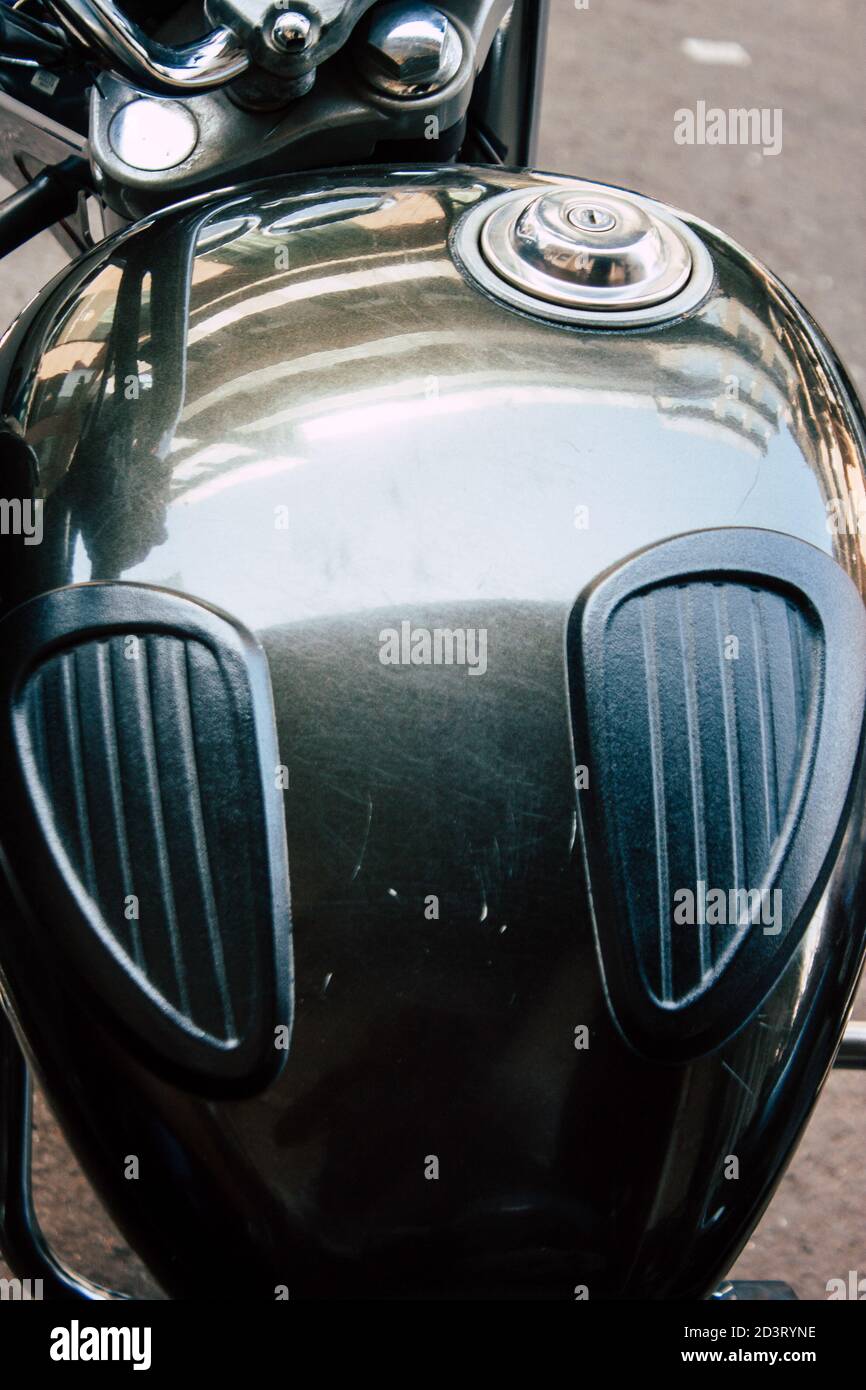 Closeup of a motorcycle rolling in the streets of the city center of ...