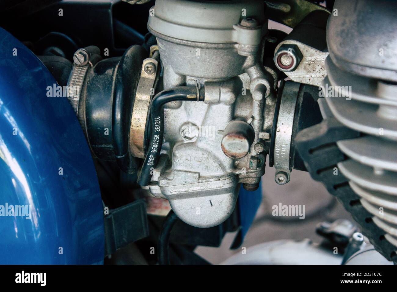 Closeup of a motorcycle rolling in the streets of the city center of ...