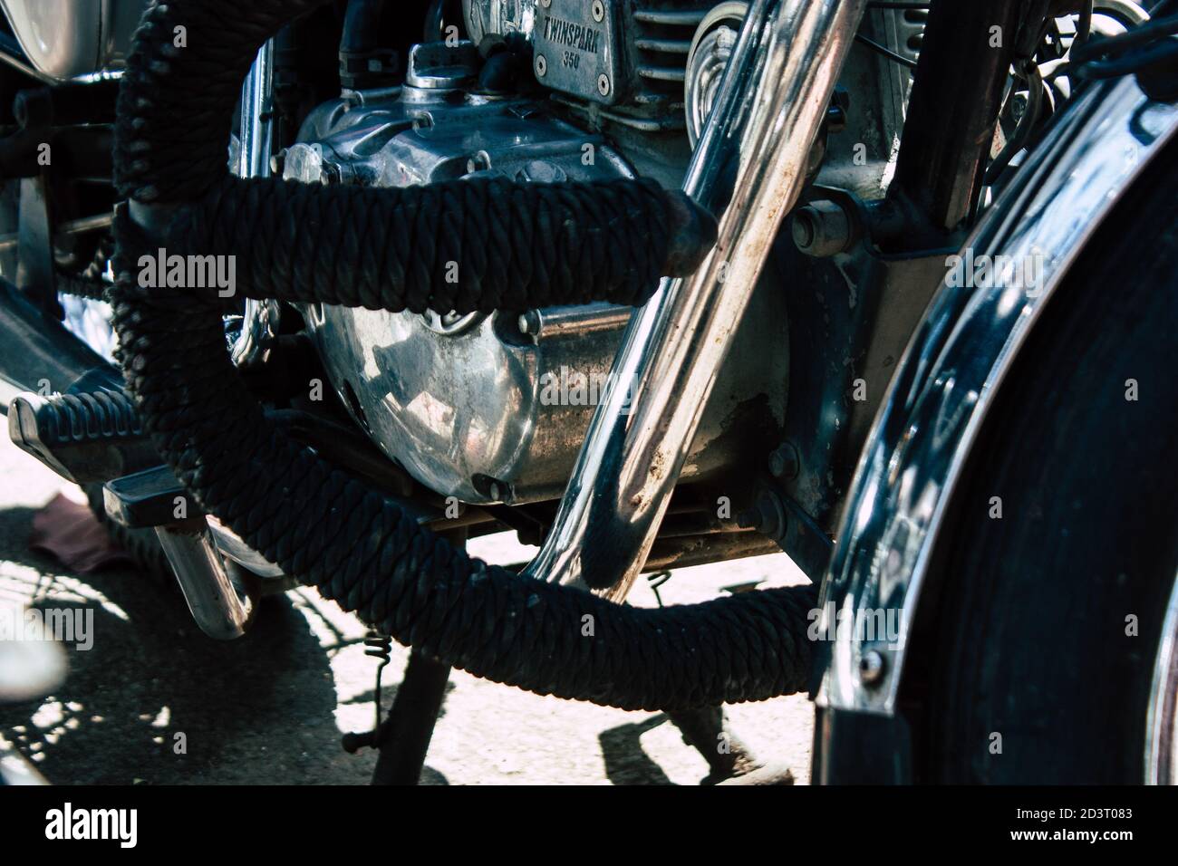 Closeup of a motorcycle rolling in the streets of the city center of ...