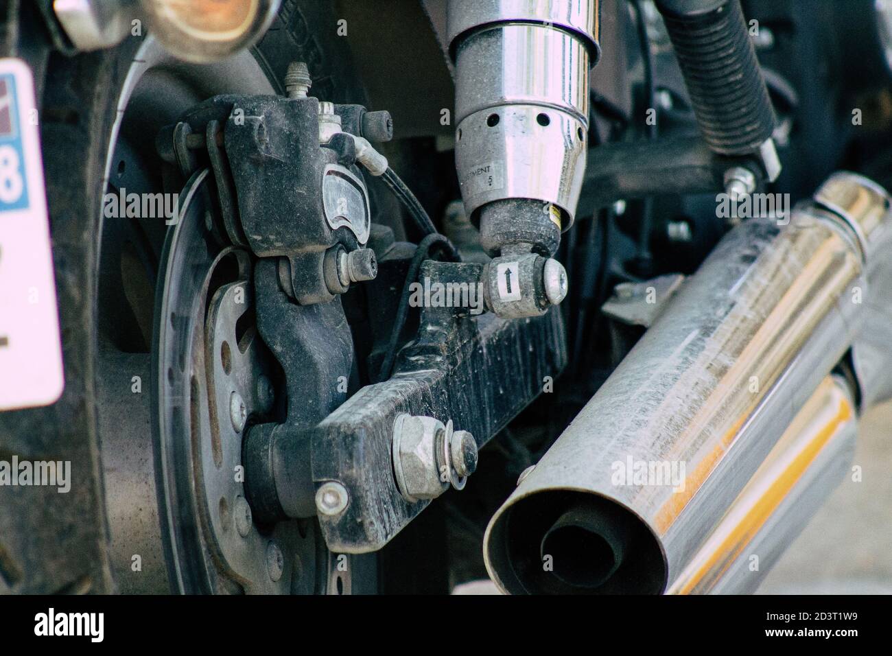 Closeup of a motorcycle rolling in the streets of the city center of ...