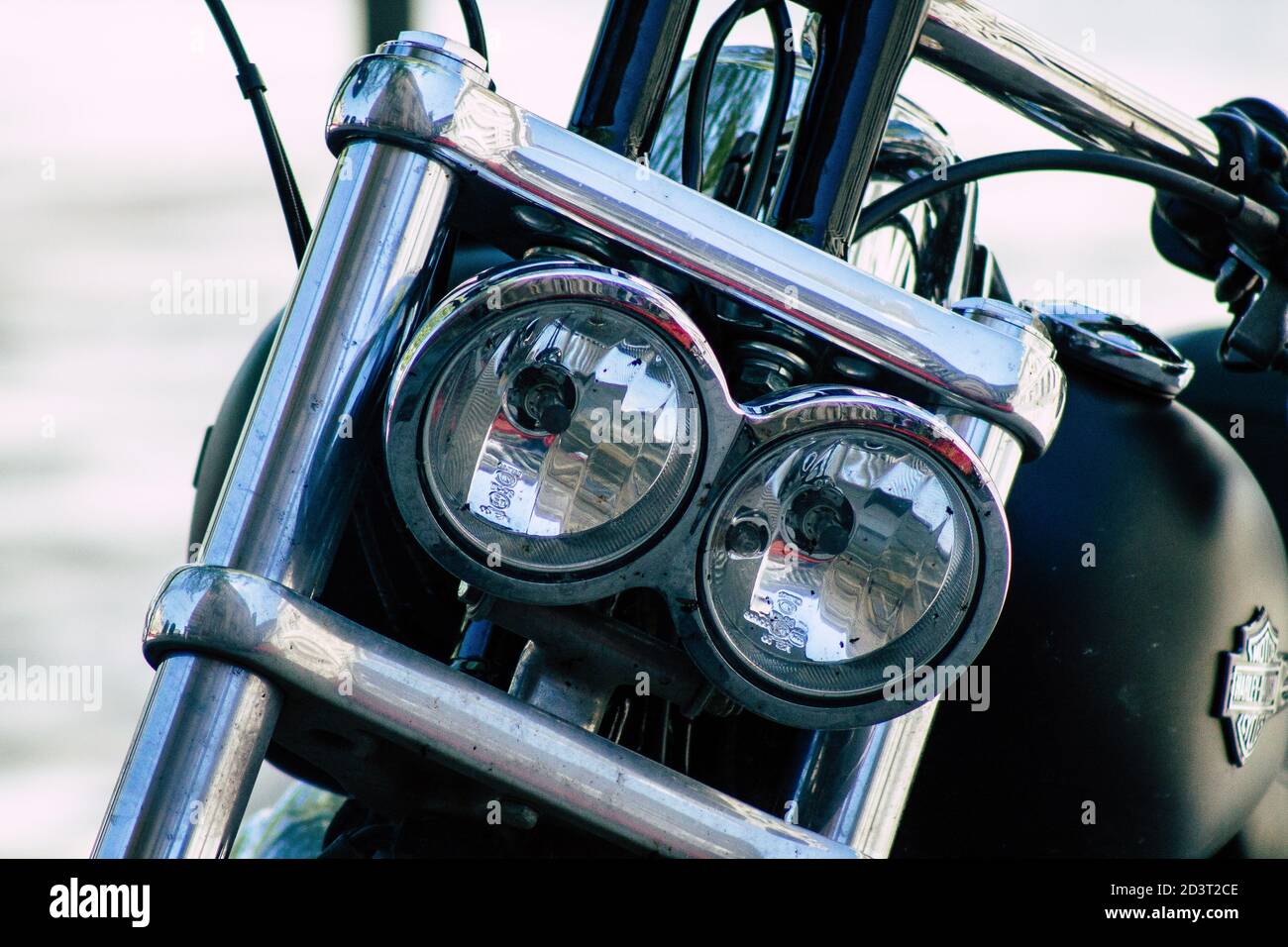 Closeup of a motorcycle rolling in the streets of the city center of ...
