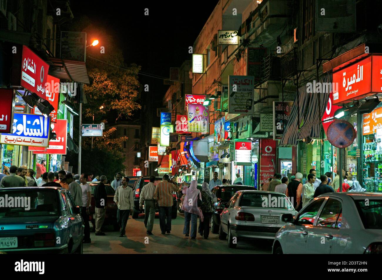 Lively life on a night street Stock Photo - Alamy