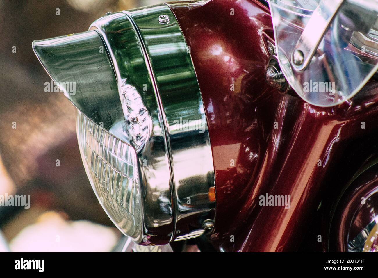 Closeup of a motorcycle rolling in the streets of the city center of ...