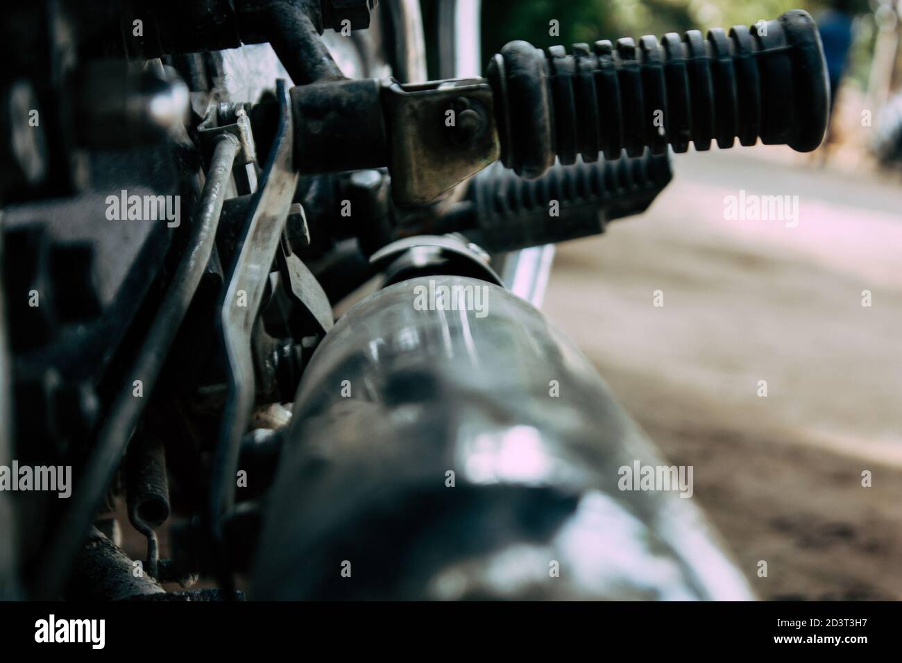 Closeup of a motorcycle rolling in the streets of the city center of ...