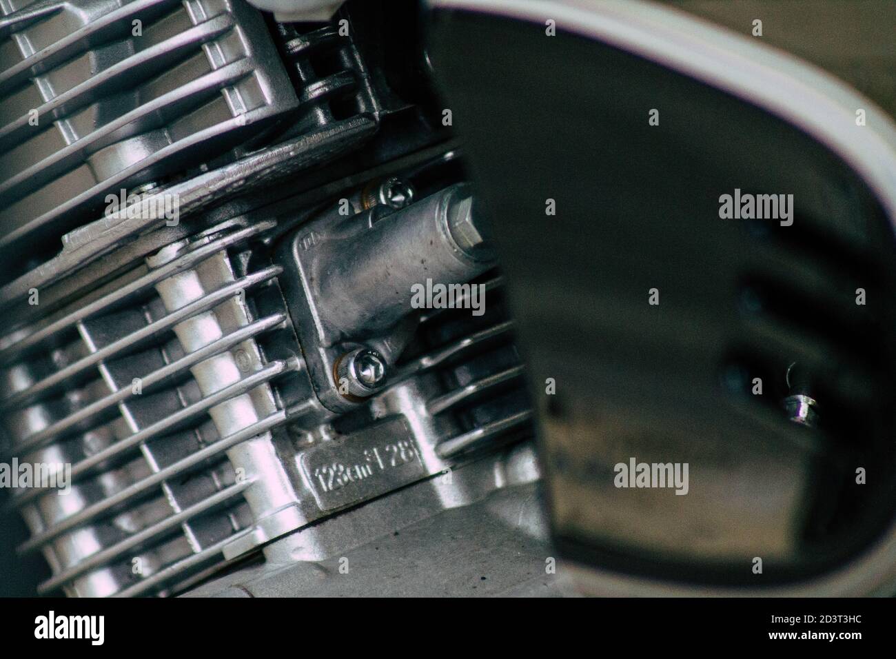 Closeup of a motorcycle rolling in the streets of the city center of ...