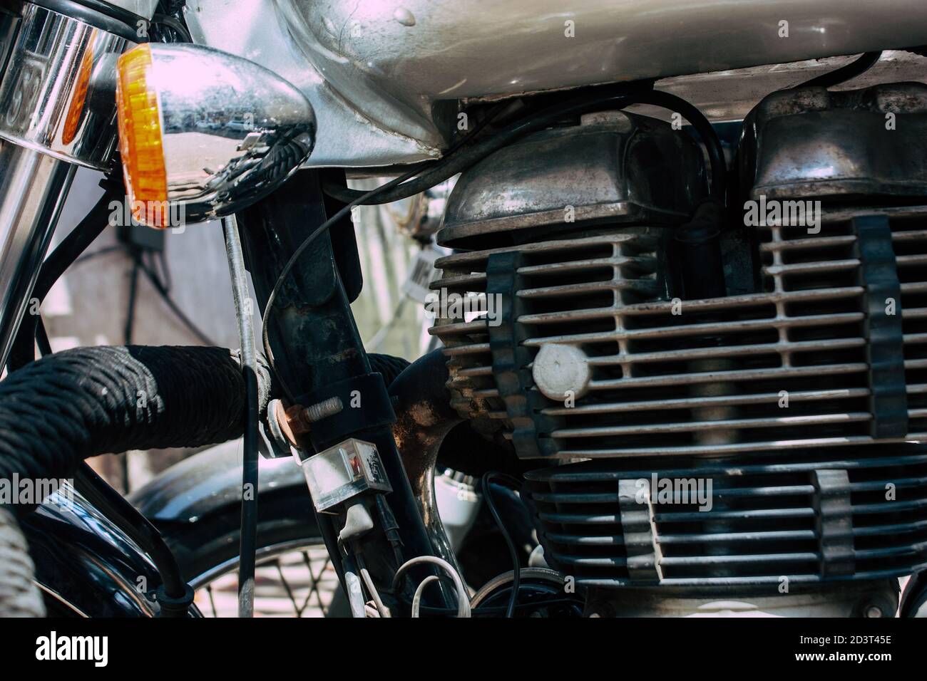 Closeup of a motorcycle rolling in the streets of the city center of ...