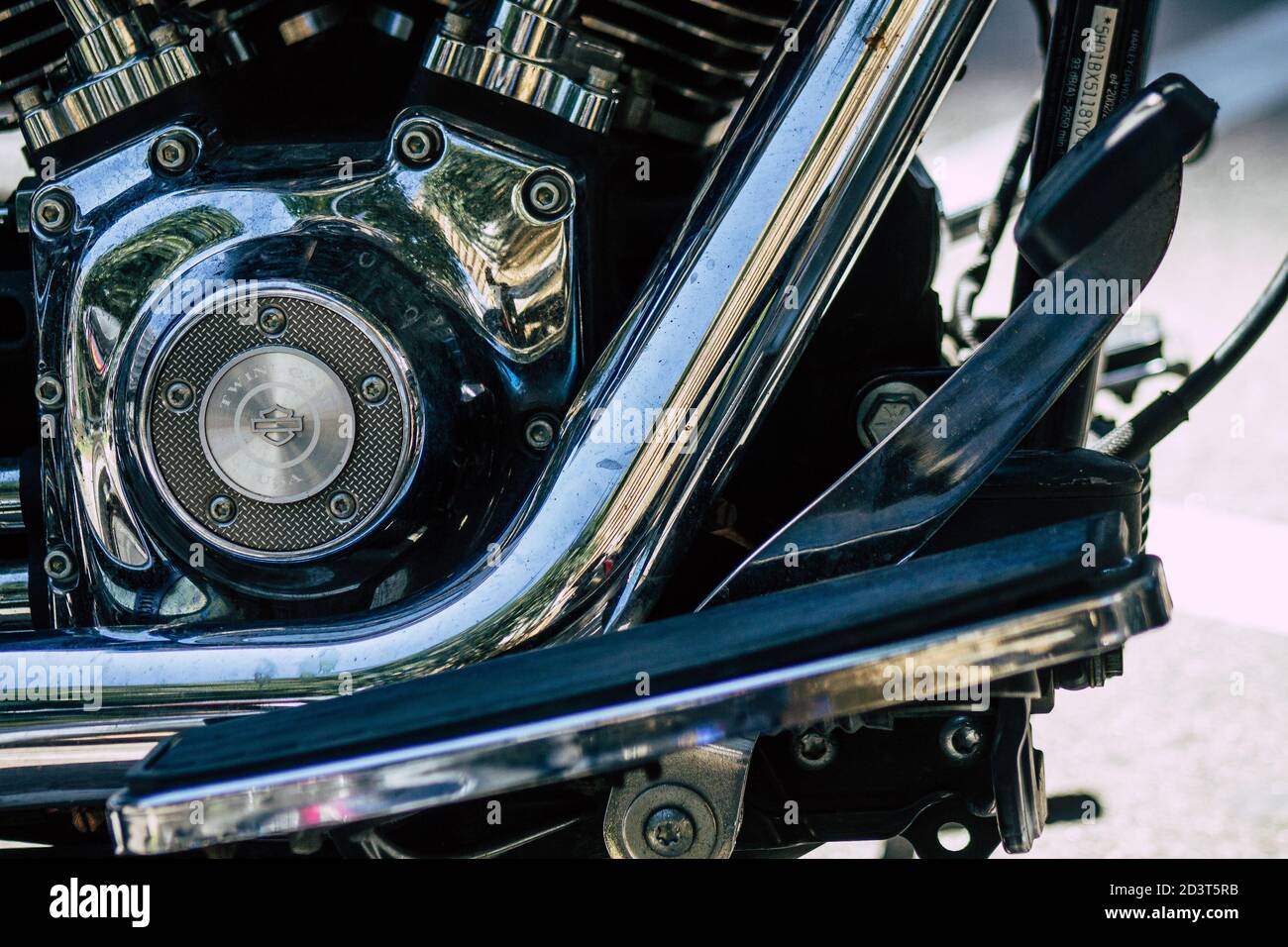 Closeup of a motorcycle rolling in the streets of the city center of ...