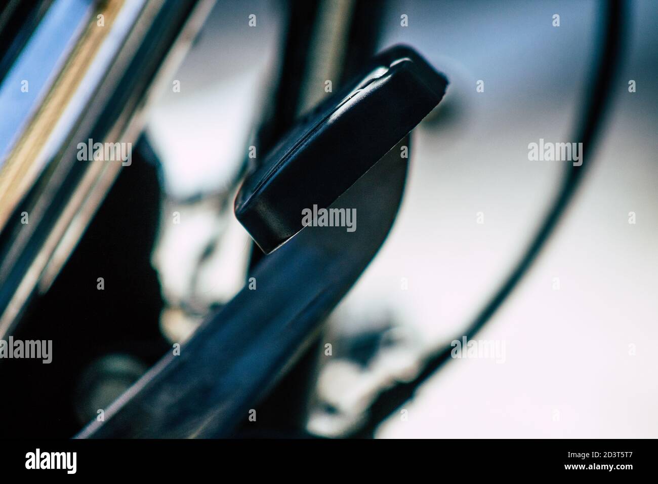 Closeup of a motorcycle rolling in the streets of the city center of ...