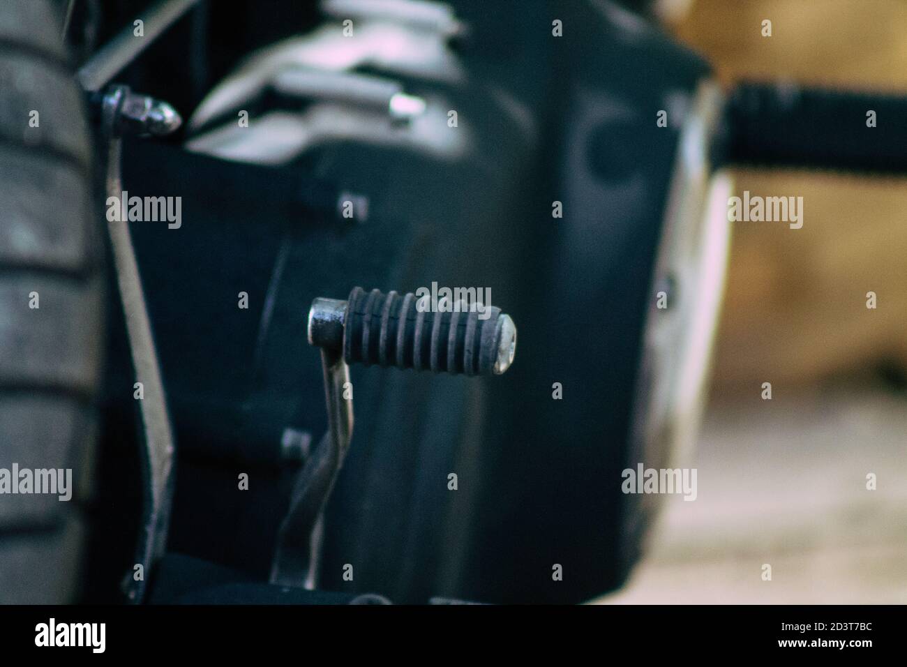 Closeup of a motorcycle rolling in the streets of the city center of ...