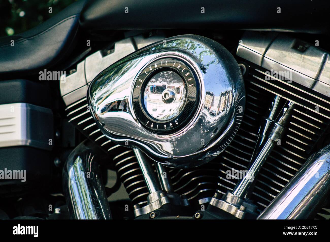 Closeup of a motorcycle rolling in the streets of the city center of ...