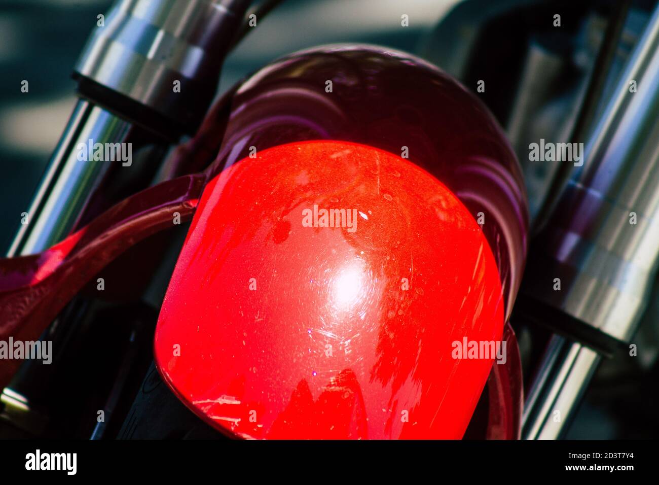 Closeup of a motorcycle rolling in the streets of the city center of ...
