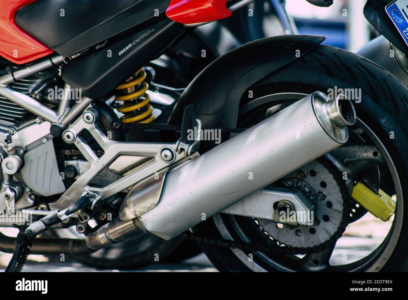 Closeup of a motorcycle rolling in the streets of the city center of ...
