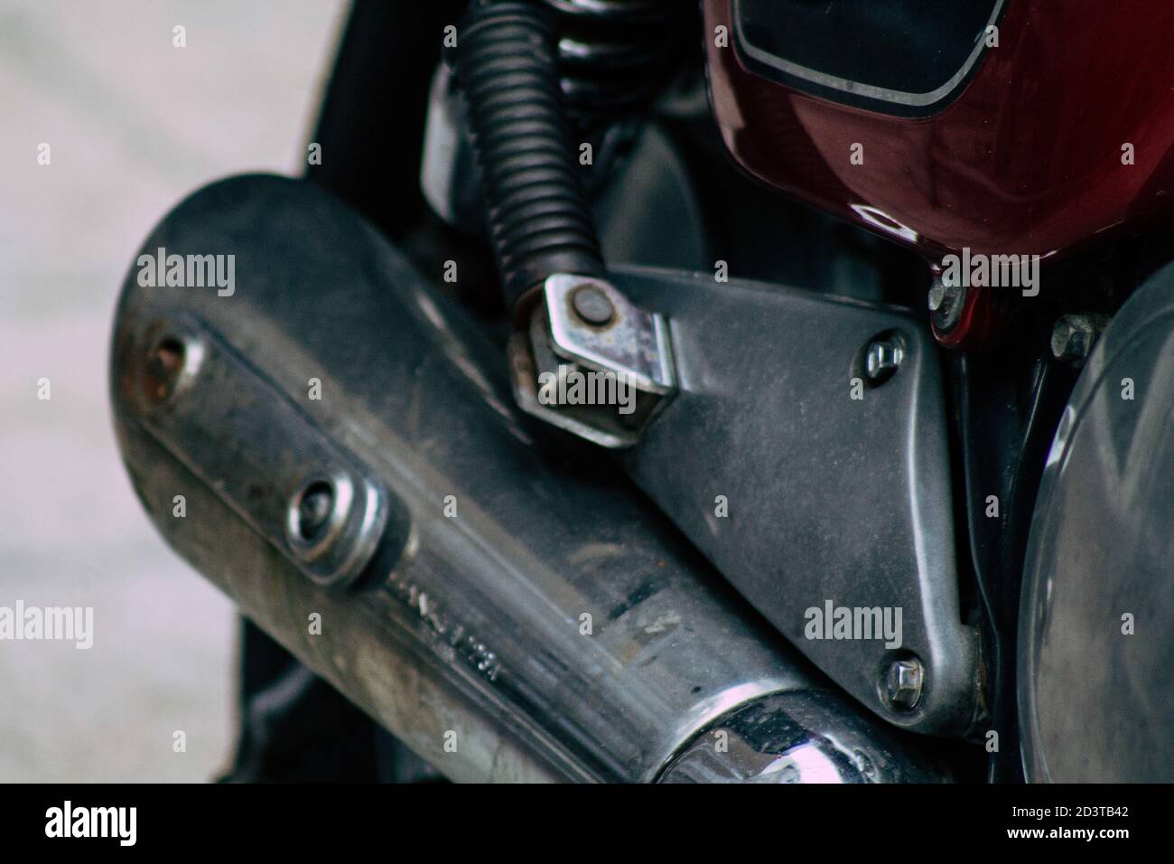 Closeup of a motorcycle rolling in the streets of the city center of ...