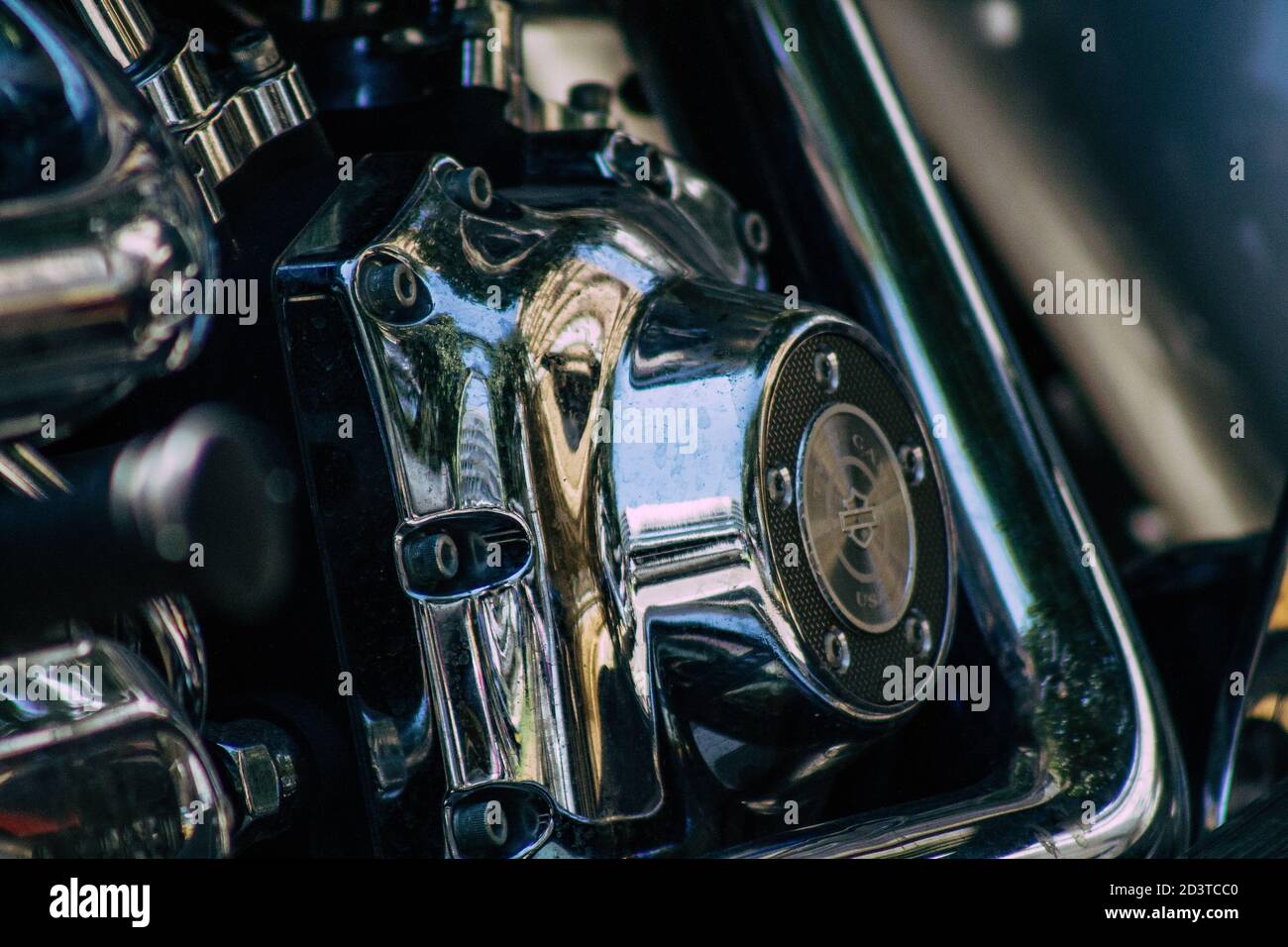 Closeup of a motorcycle rolling in the streets of the city center of ...