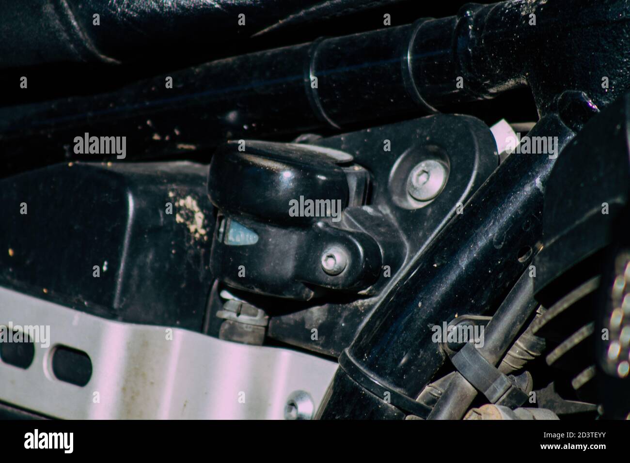 Closeup of a motorcycle rolling in the streets of the city center of ...