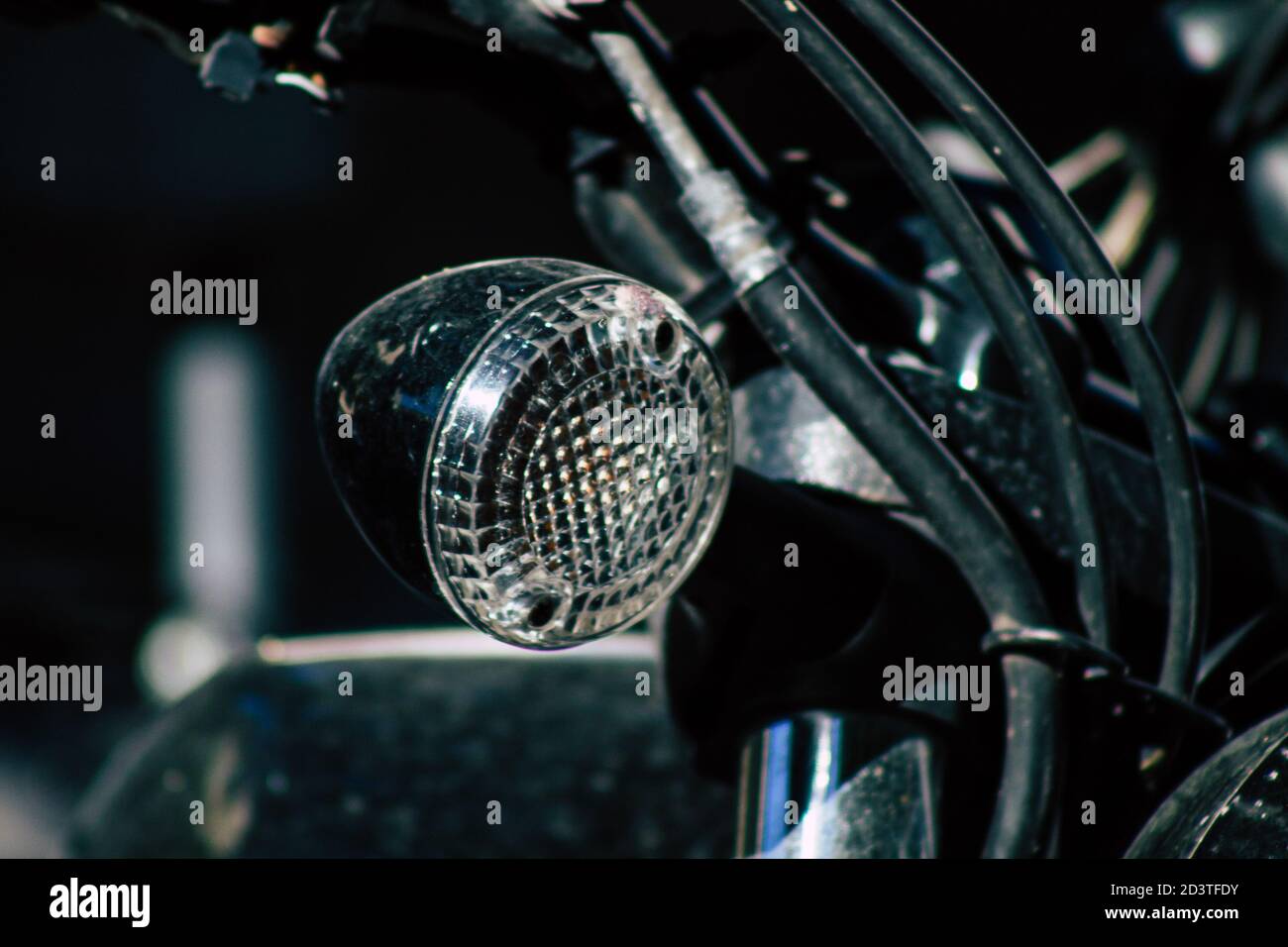 Closeup of a motorcycle rolling in the streets of the city center of ...