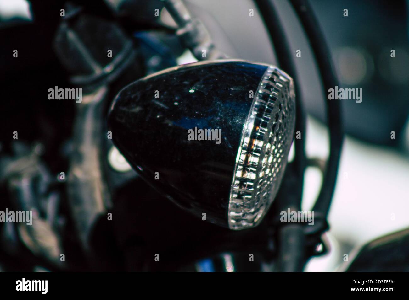 Closeup of a motorcycle rolling in the streets of the city center of ...