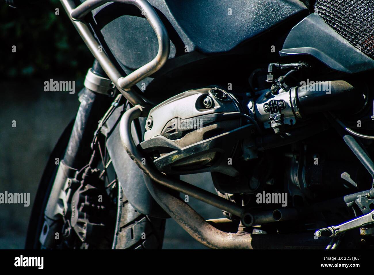 Closeup of a motorcycle rolling in the streets of the city center of ...