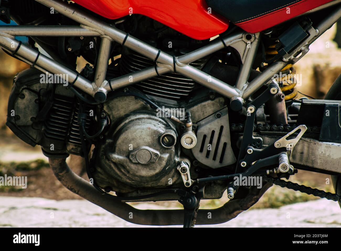 Closeup of a motorcycle rolling in the streets of the city center of ...