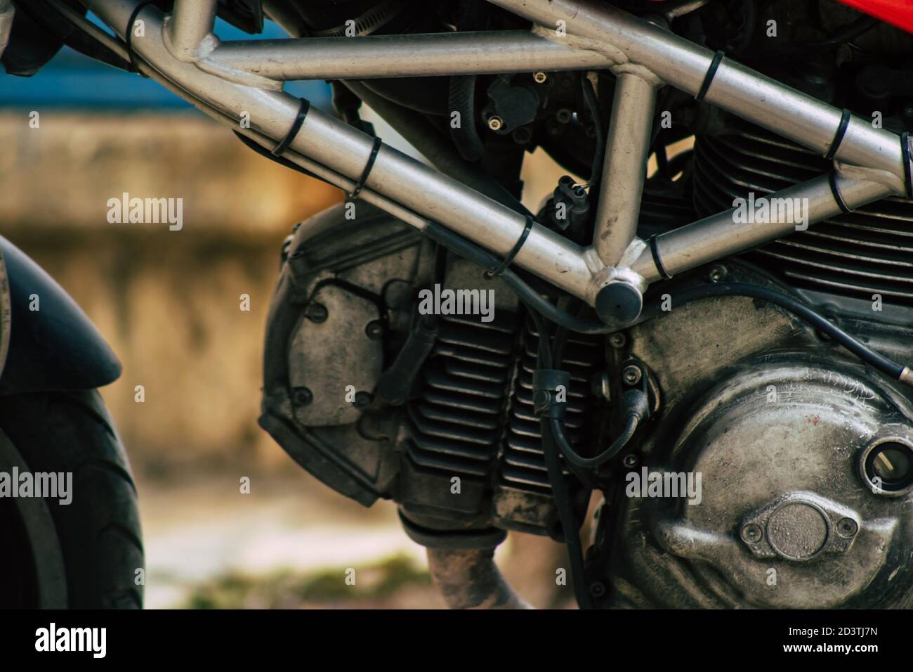Closeup of a motorcycle rolling in the streets of the city center of ...