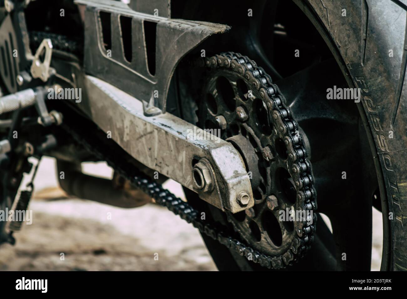 Closeup of a motorcycle rolling in the streets of the city center of ...