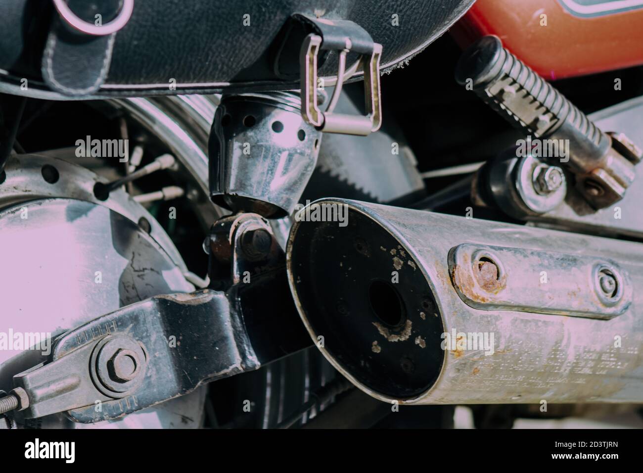 Closeup of a motorcycle rolling in the streets of the city center of ...
