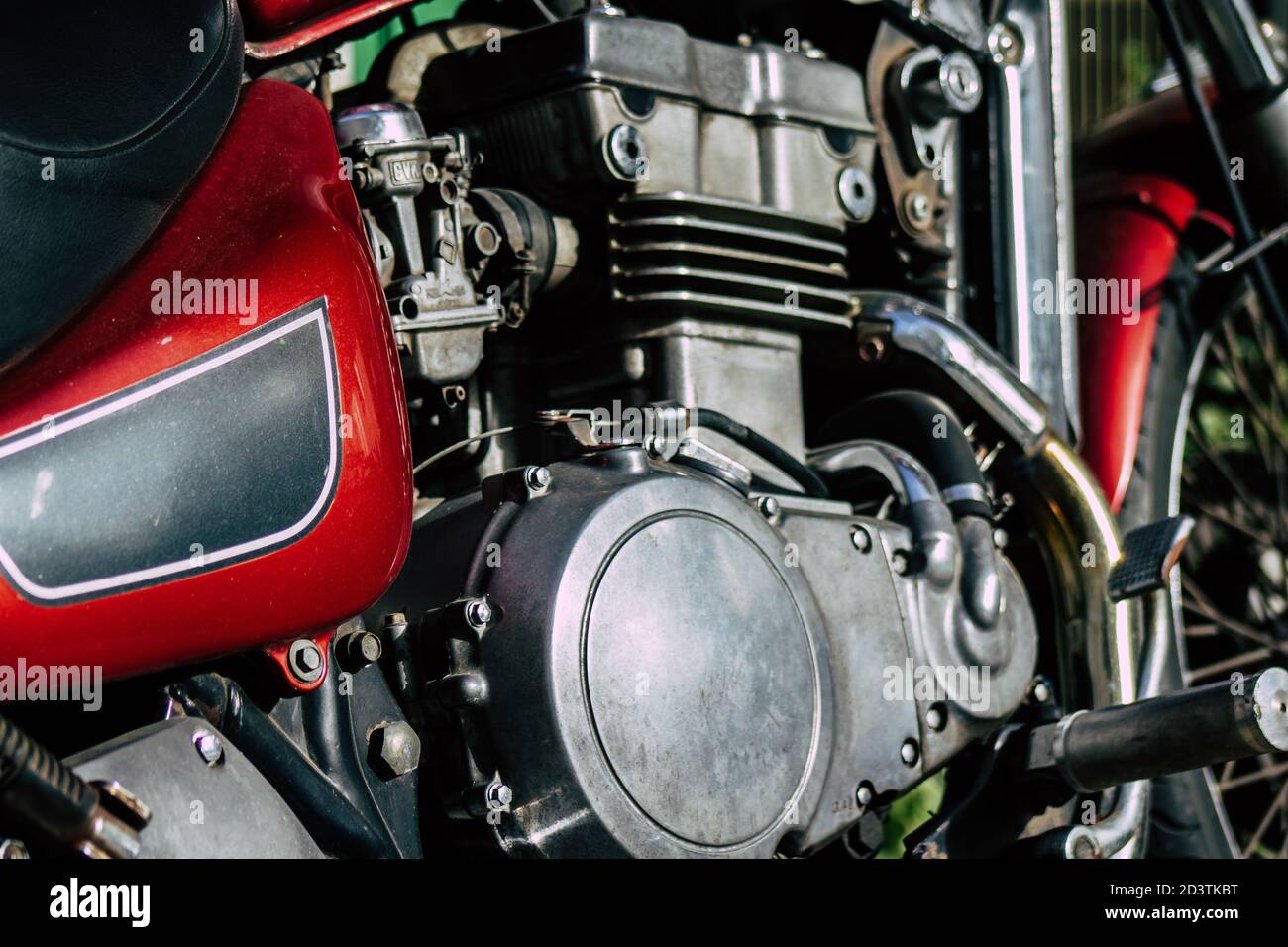 Closeup of a motorcycle rolling in the streets of the city center of ...