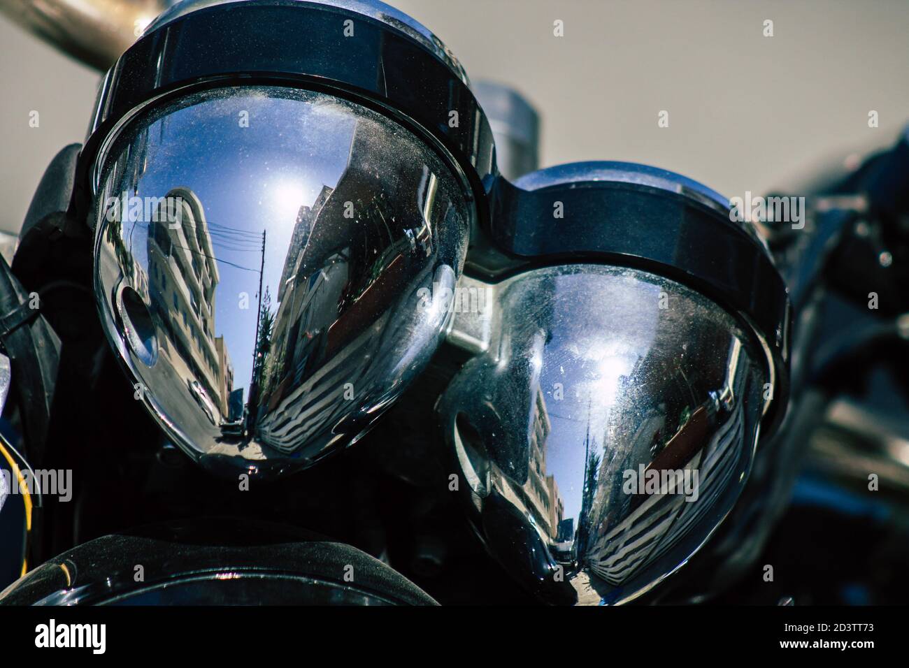 Closeup of a motorcycle rolling in the streets of the city center of ...