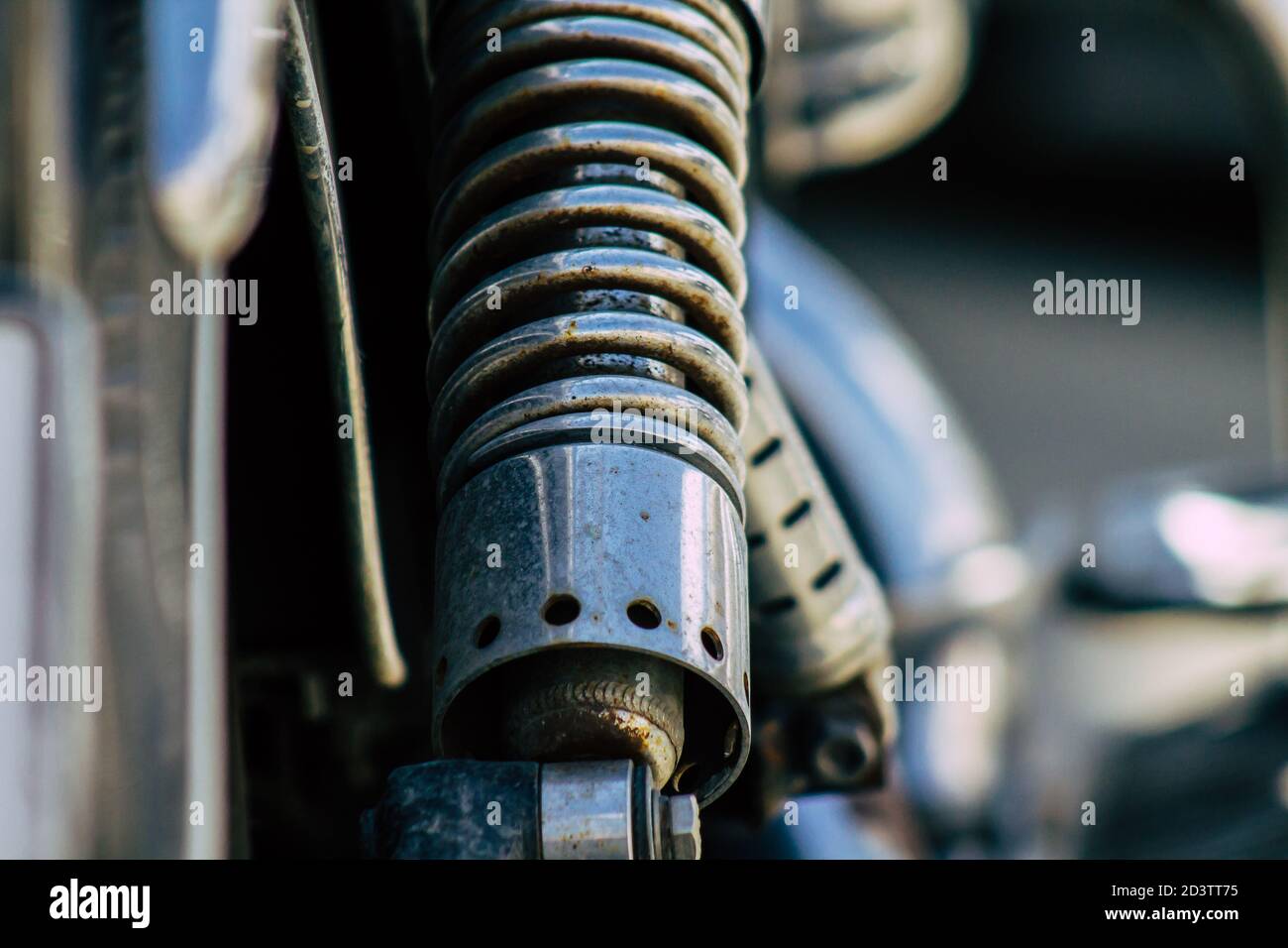 Closeup of a motorcycle rolling in the streets of the city center of ...