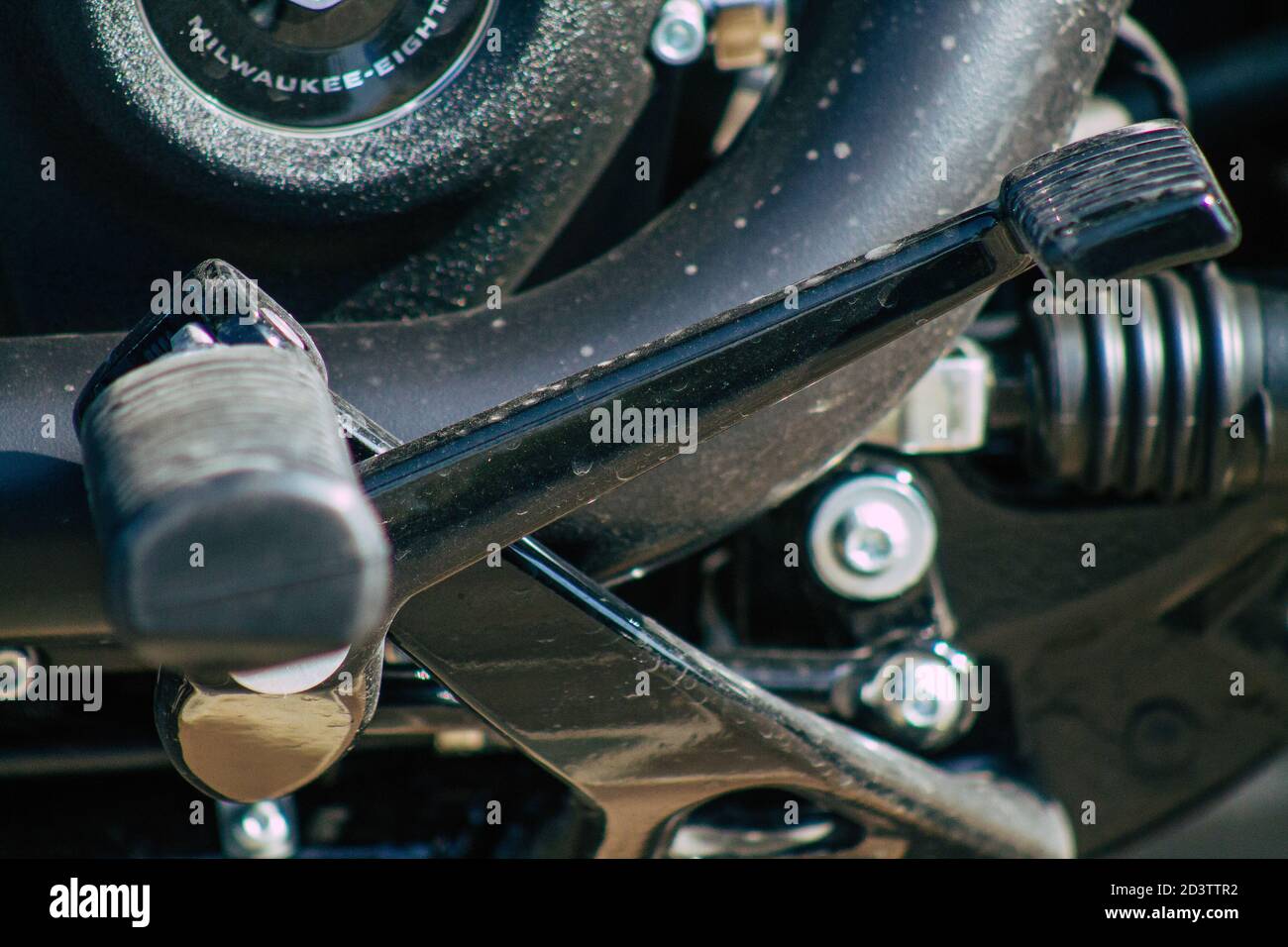 Closeup of a motorcycle rolling in the streets of the city center of ...