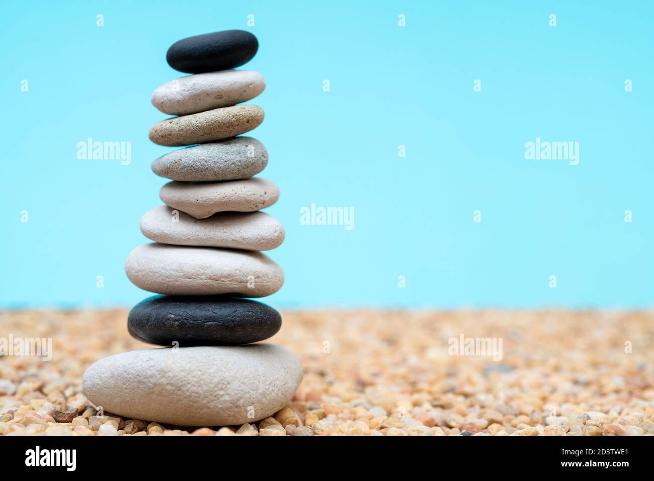 Stack of pebbles in an unstable state. A pyramid made of flat stones ...