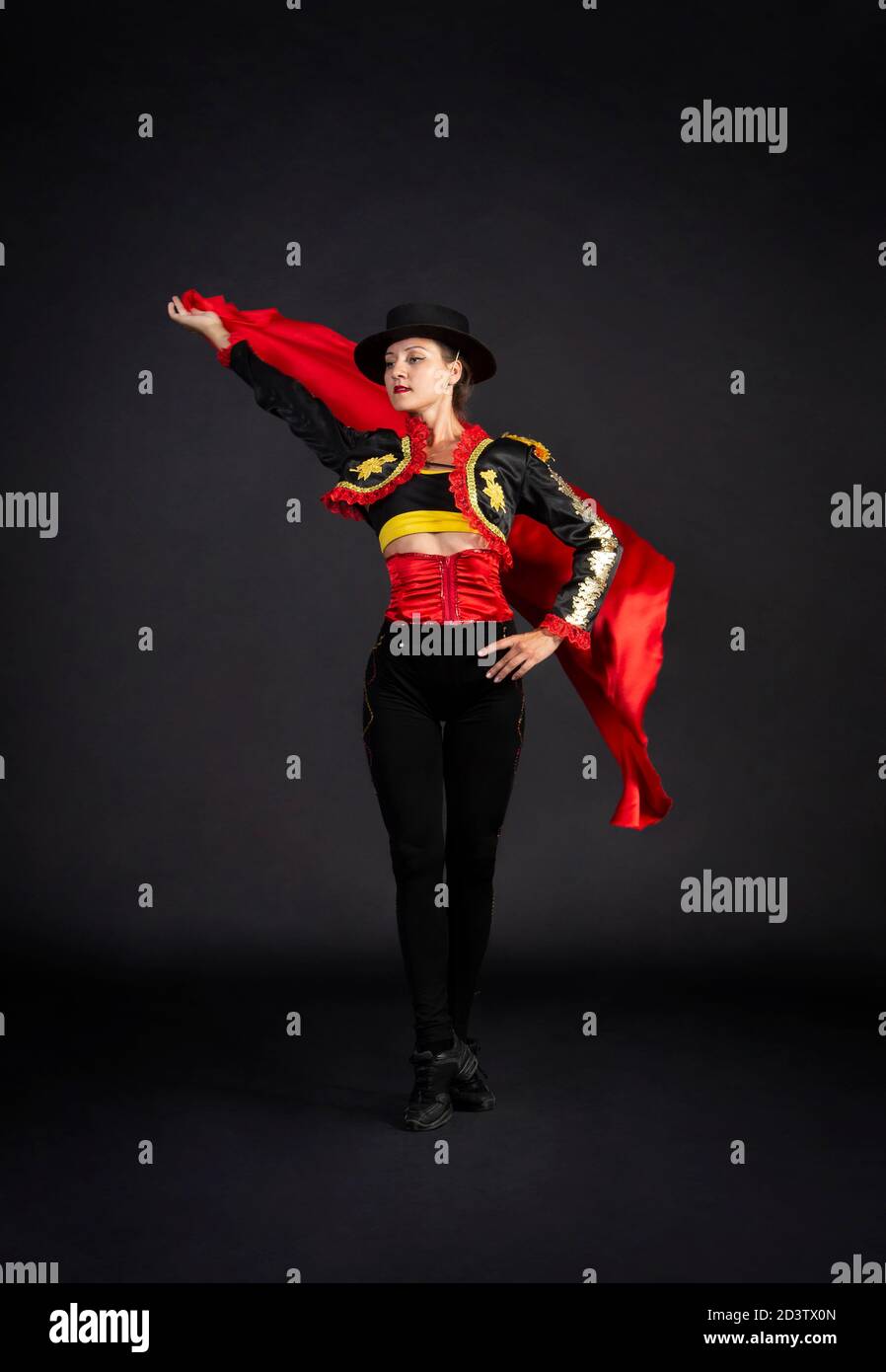 Plastic woman gracefully dancing in a stage costume stylized as a ...