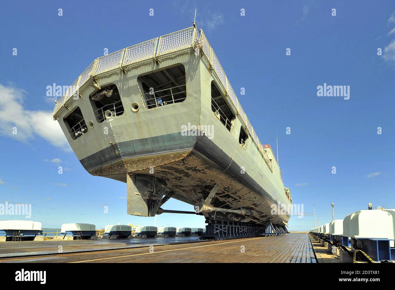 Royal Australian Navy frigate being raised on a synchro lift for ...
