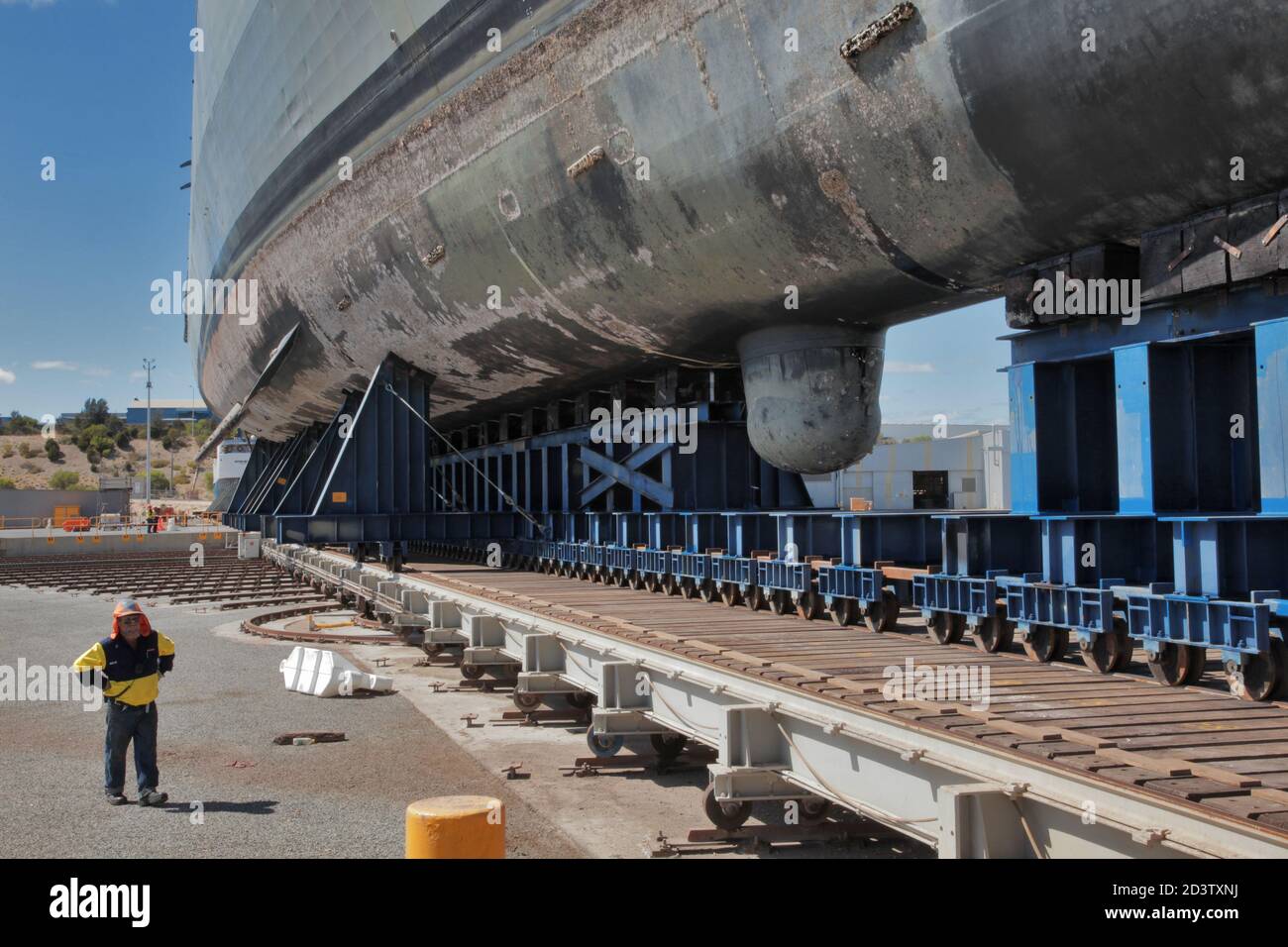 Royal Australian Navy frigate being raised on a synchro lift for ...