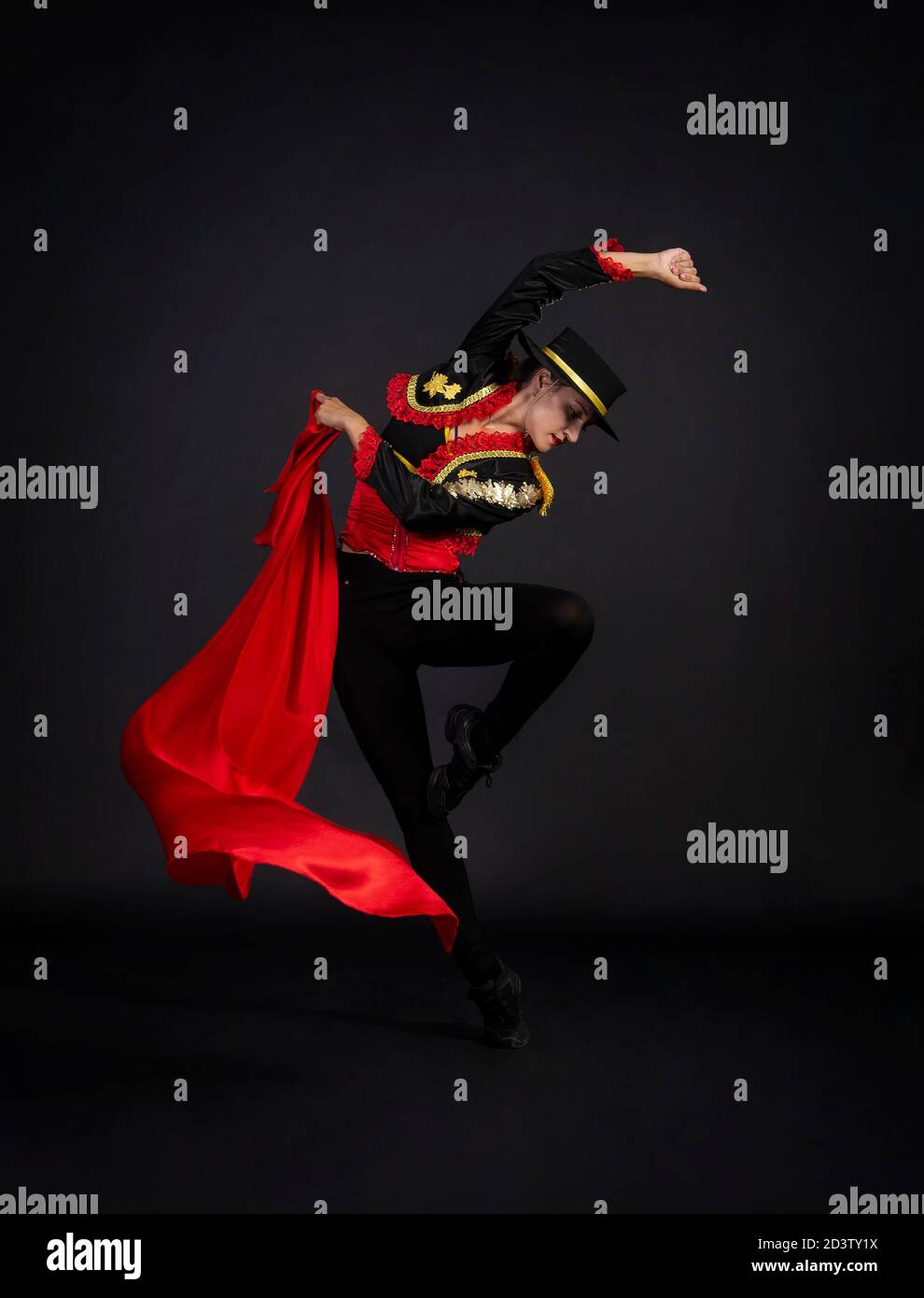 Plastic woman gracefully dancing in a stage costume stylized as a ...