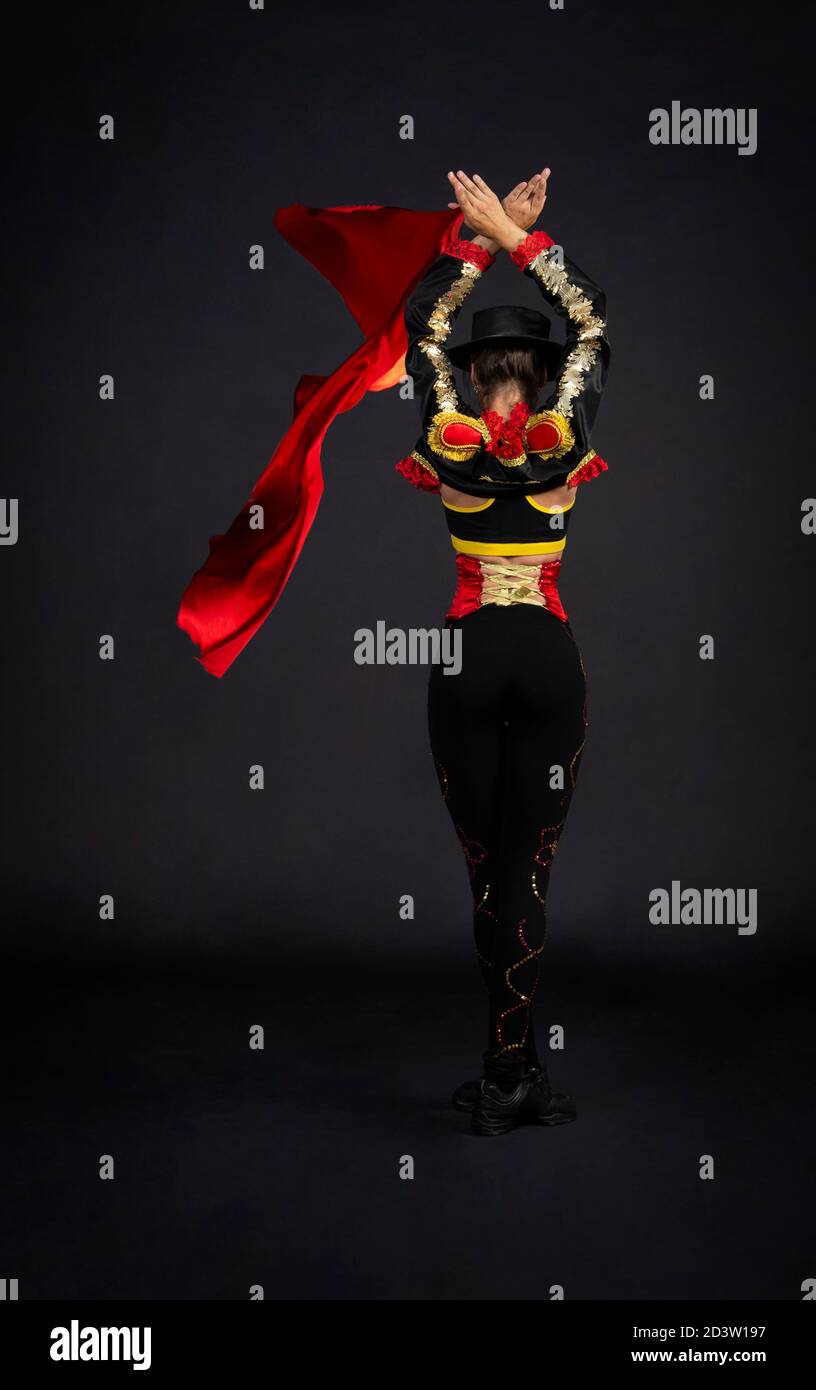 Plastic woman gracefully dancing in a stage costume stylized as a ...