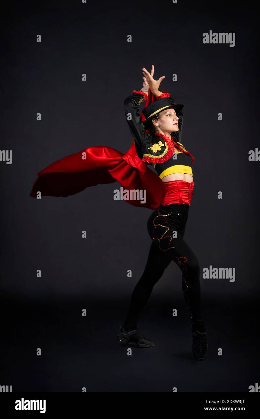 Plastic woman gracefully dancing in a stage costume stylized as a ...