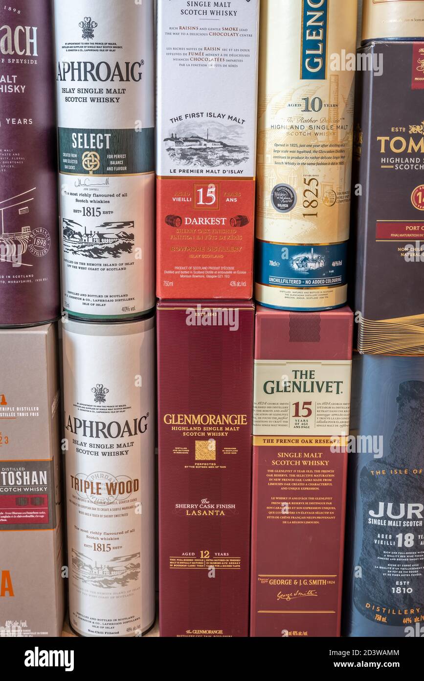 Miscellaneous scotch whisky presentation boxes stacked together to ...
