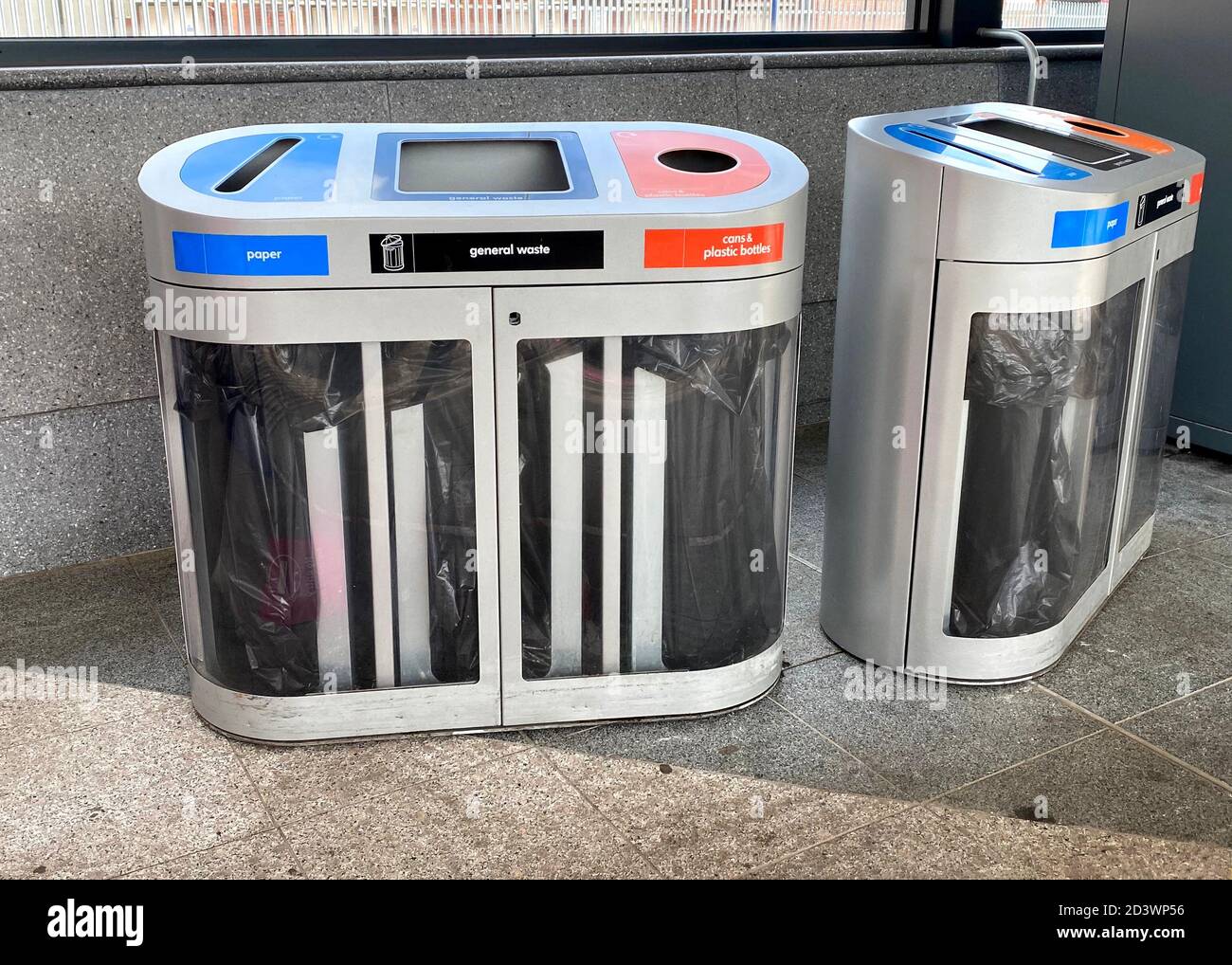recycle bins in the bus stop Stock Photo - Alamy