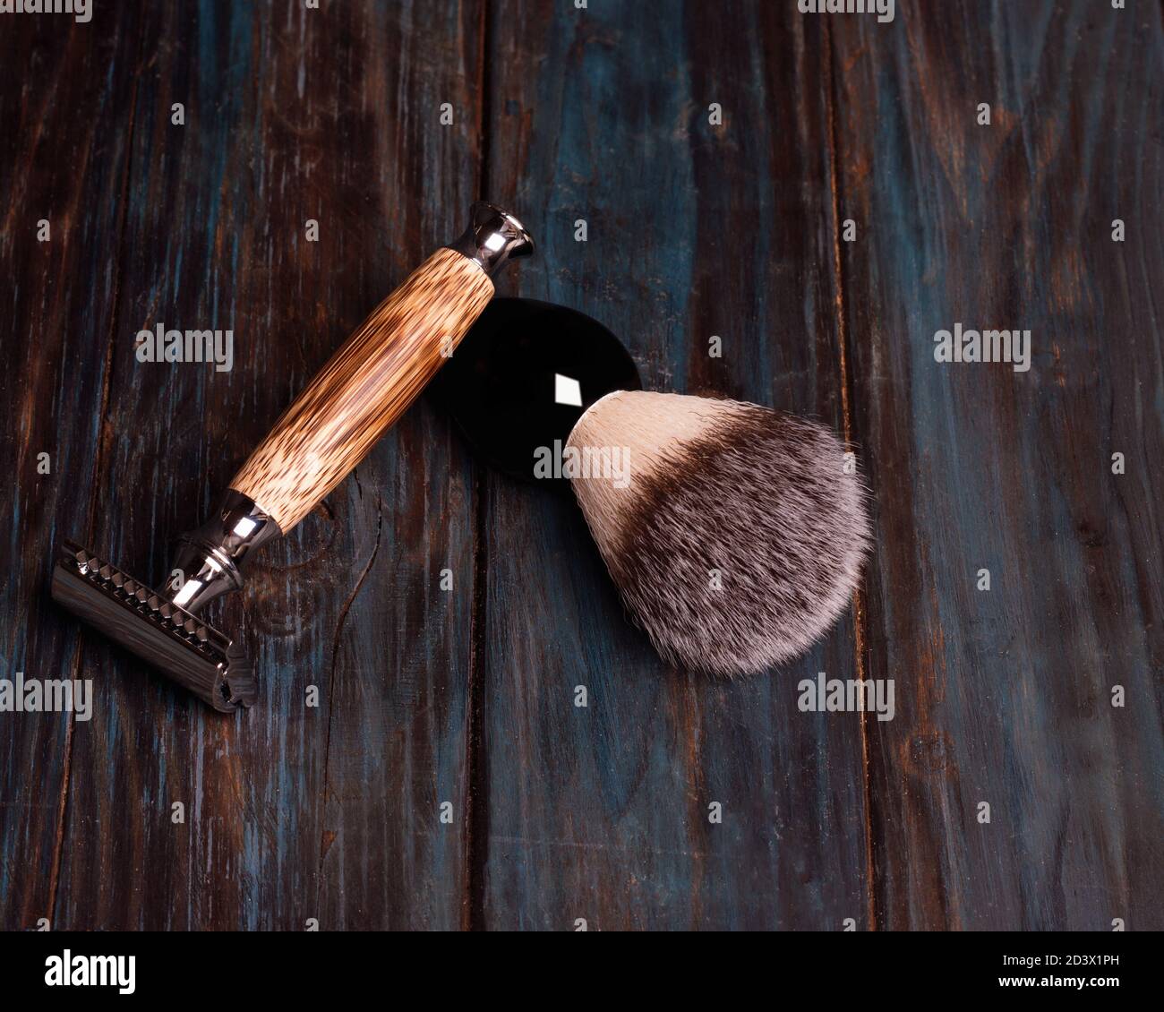 Razors and brush on a wood background Stock Photo - Alamy