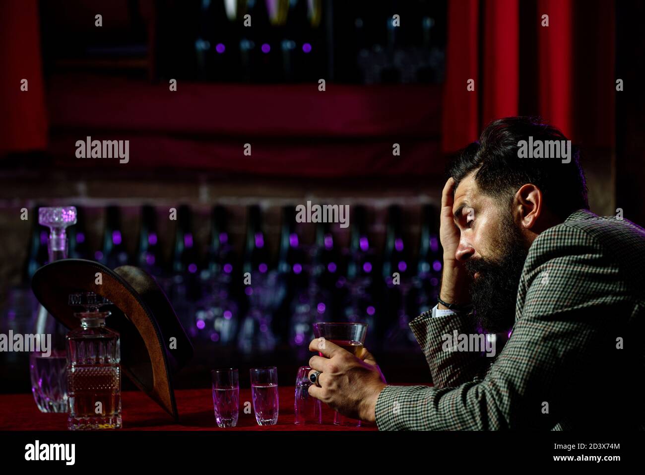 Bad habit, alcohol addiction. Handsome bearded man enjoying whiskey in ...