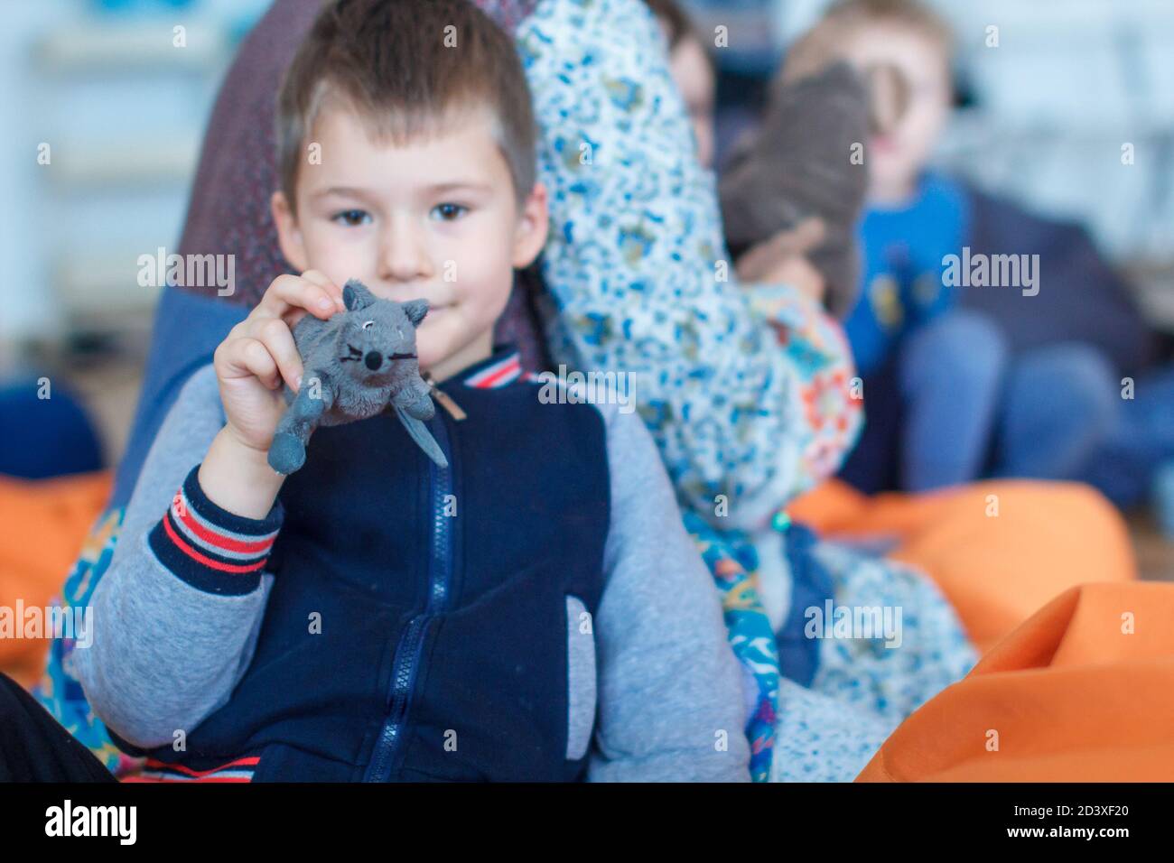 Portrait of a boy with a toy mouse Stock Photo - Alamy