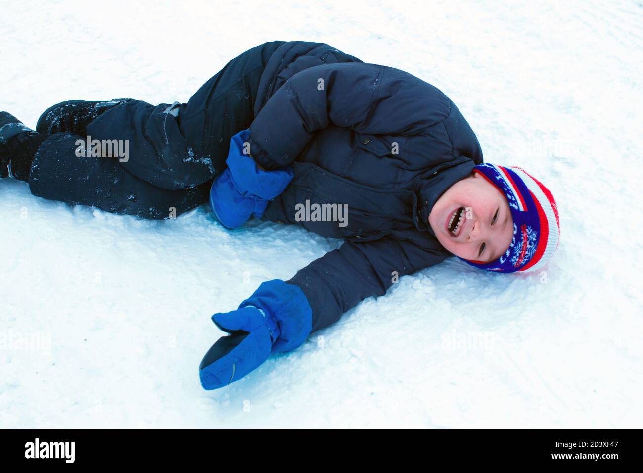 Happy smiling boy lies in hi-res stock photography and images - Alamy
