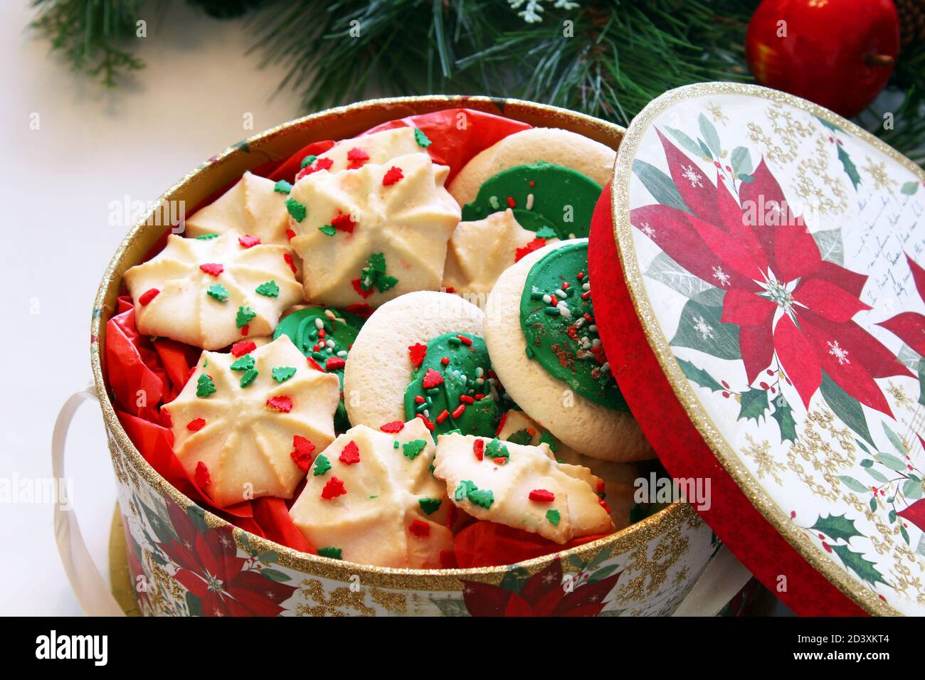 Christmas cookies in a decorated tin container Stock Photo - Alamy