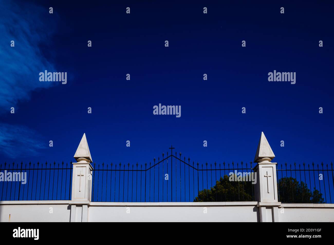 Sign of the cross engraved on the white walls of a cemetery, concept of ...