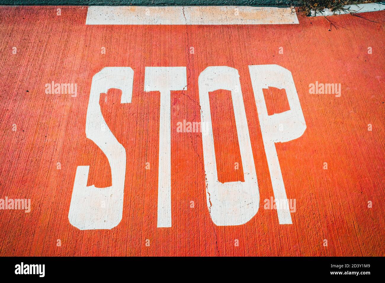 White and red stop floor road sign hi-res stock photography and images ...