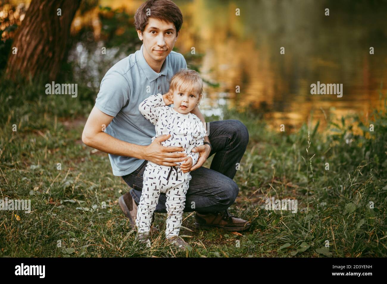 happy family father and son walking in nature Stock Photo - Alamy