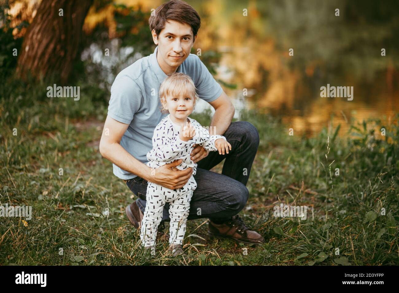 happy family father and son walking in nature Stock Photo - Alamy