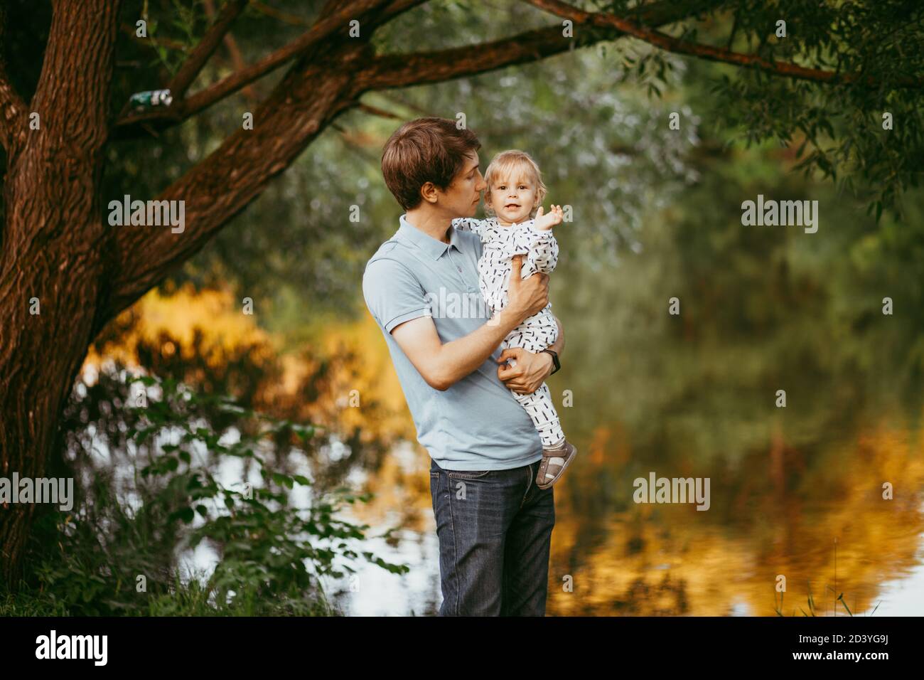 happy family father and son walking in nature Stock Photo - Alamy